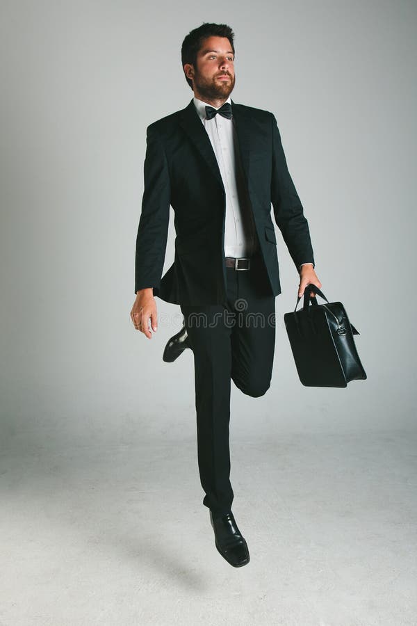 Stylish Young Man with Black Suit and Briefcase. Stock Image - Image of ...