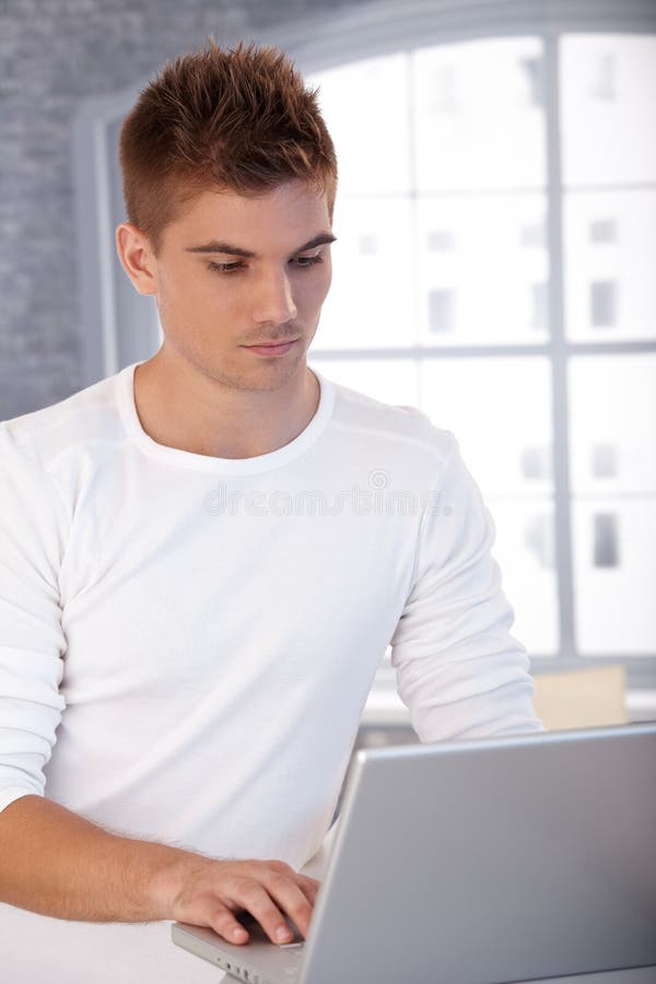 Stylish Young Man with Computer Stock Image - Image of concentrating ...