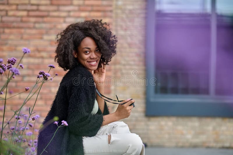 Stylish Young Woman with Camera Looking Contented Stock Image - Image ...