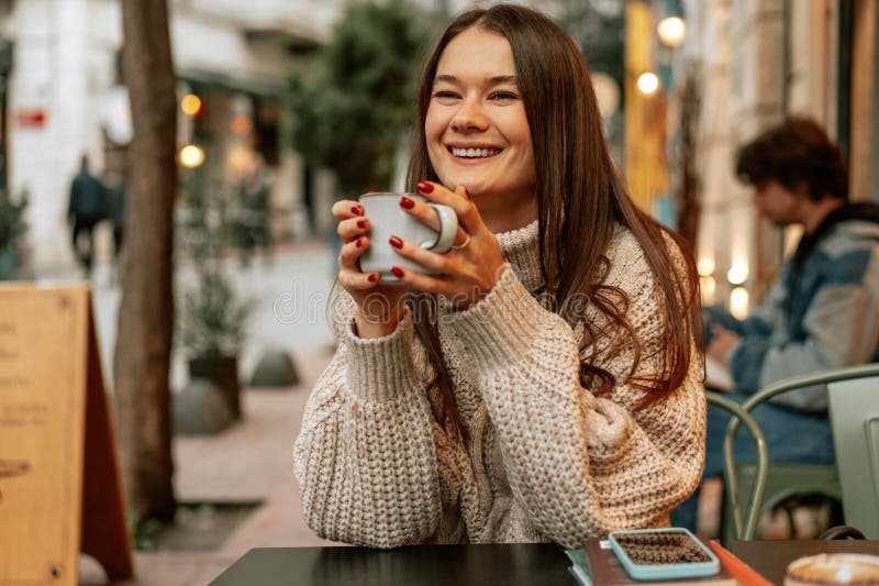 Stylish Young Woman Drinking Coffee at the Coffee Shop Stock Image ...