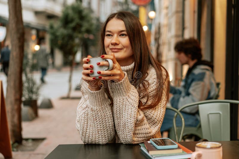 Stylish Young Woman Drinking Coffee at the Coffee Shop Stock Image ...