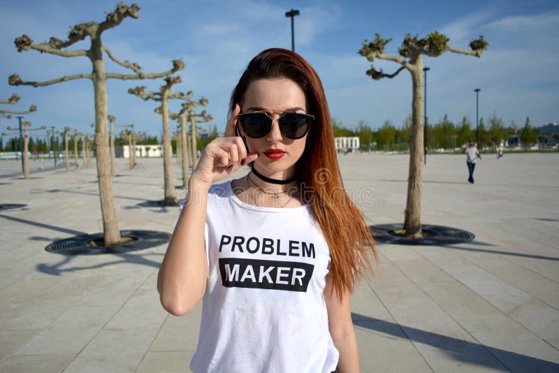 Stylish Young Woman Looking Forward and Wearing Sunglasses Stock Image ...