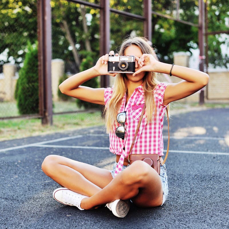 Stylish Young Woman Using a Camera To Take Photo Stock Photo - Image of ...