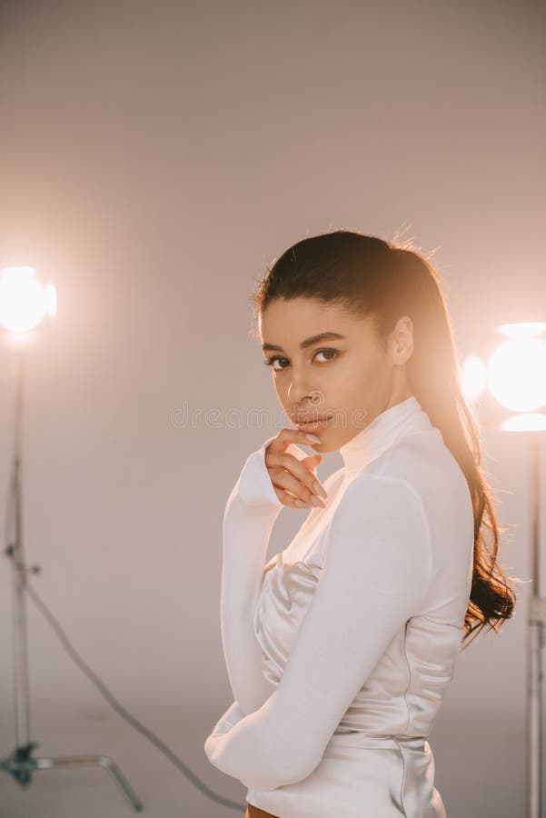 Stylish Young Woman in White Turtle Neck Posing in Studio Stock Image ...