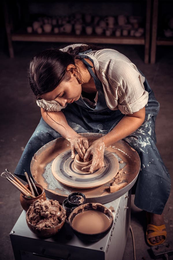 Charming Pottery Master Making Ceramic Pot on the Pottery Wheel ...