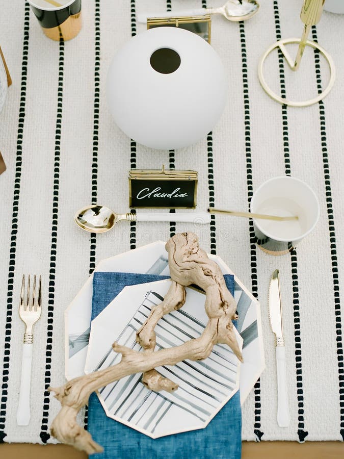 Elegant Table Setting with Modern Decor and Unique Centerpiece at a ...