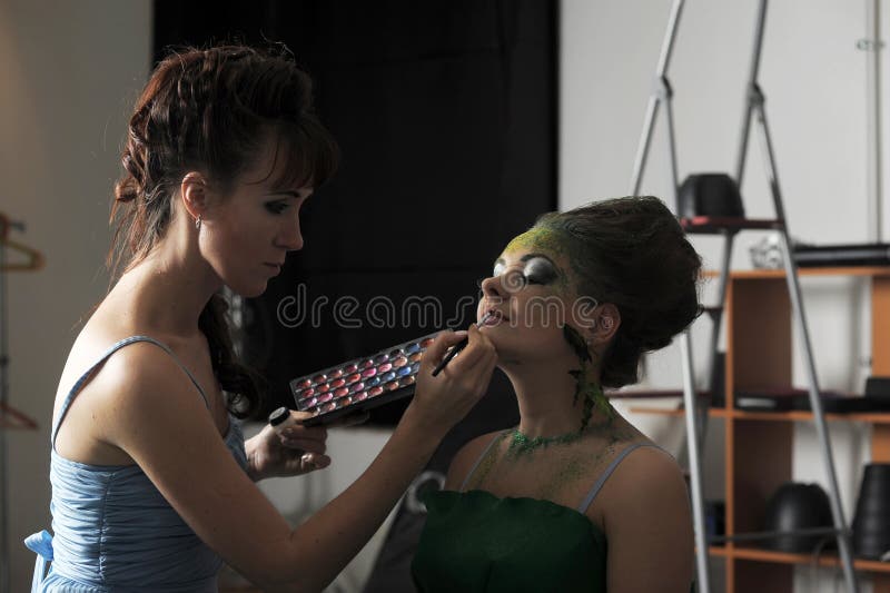 Stylist makes makeup model stock image. Image of closeup - 168452833