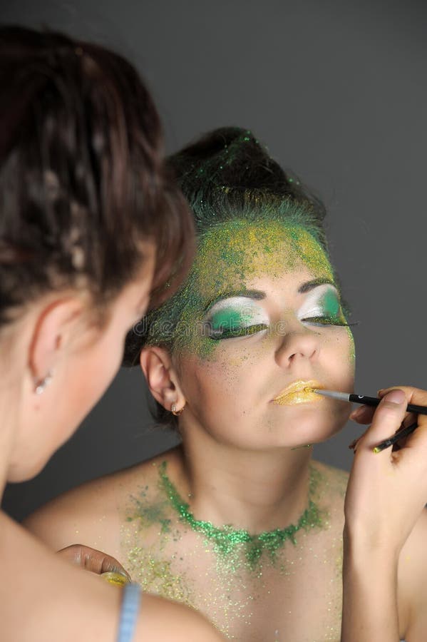 Stylist makes makeup model stock image. Image of apply - 168452851