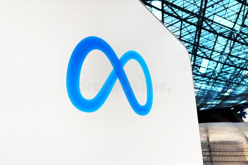 Stylized Blue Meta Infinity Logo Mounted on White Wall in Modern ...