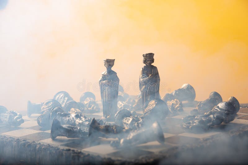 Stylized Chess Pieces on a Board with Orange Background, Smoke and ...