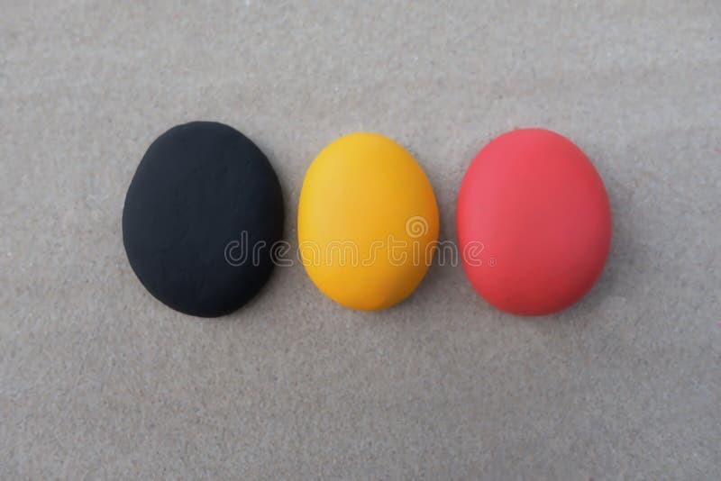 Stylized German Flag Composed with Colored Pebbles on the Beach Stock ...