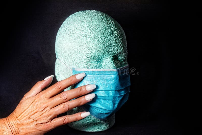 Styrofoam Human Head with Face Mask and a Touching Hand Stock Photo ...