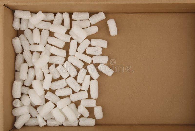 Styrofoam Packing Peanuts in Cardboard Box Background. Stock Photo ...