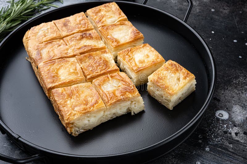 Su Boregi Pie, Turkish Tabla Borek or Burek, on Black Dark Stone Table ...