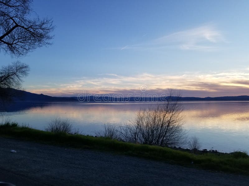 Sunset water reflection stock image. Image of sunlight - 250719855