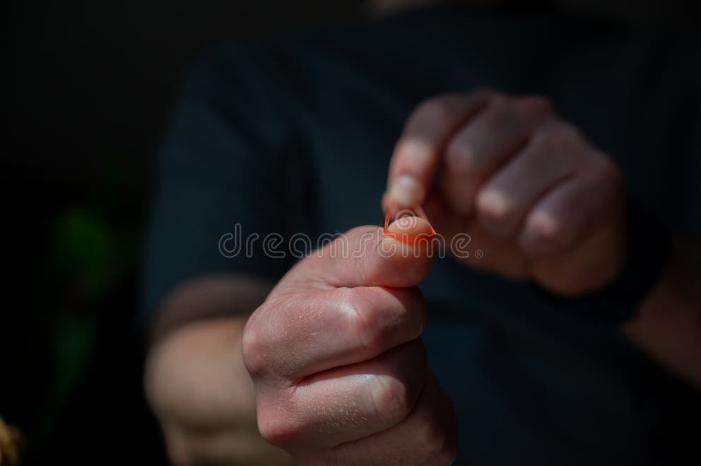 Subjective Focus on Rubber Band Pulled Taunt Being Aimed at the Camera ...
