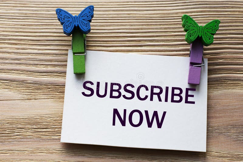 SUBSCRIBE NOW - Text on White Cardboard with Beautiful Clothespins ...