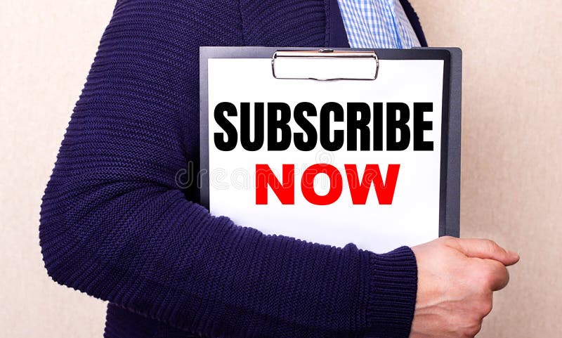 SUBSCRIBE NOW is Written on a White Sheet Held by a Man Standing ...