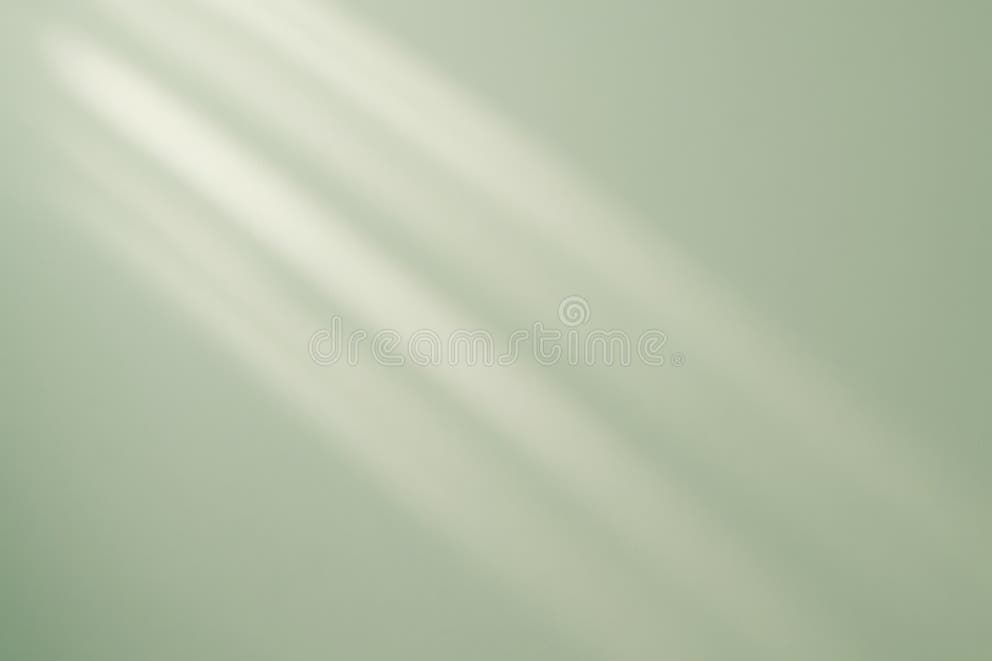 Subtle Light Beams Cast Soft Shadows on a Pale Green Wall Stock ...