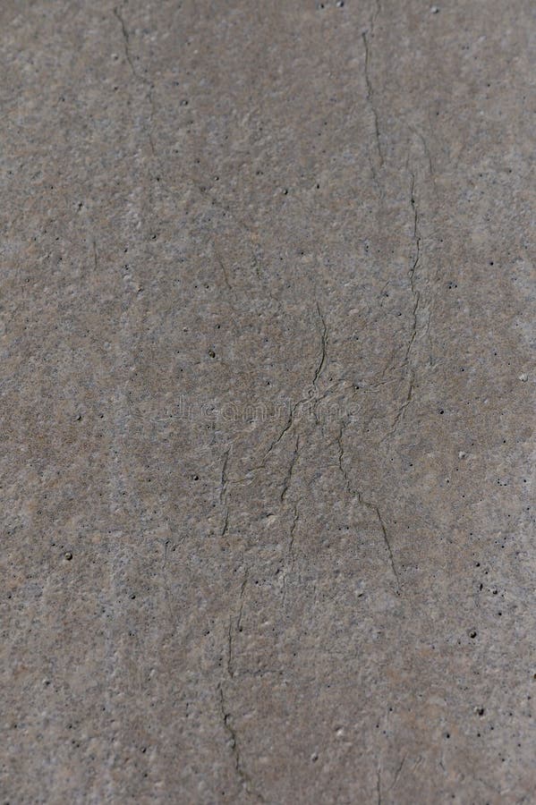 Subtle Textures and Cracks of a Weathered Concrete Surface Create an ...