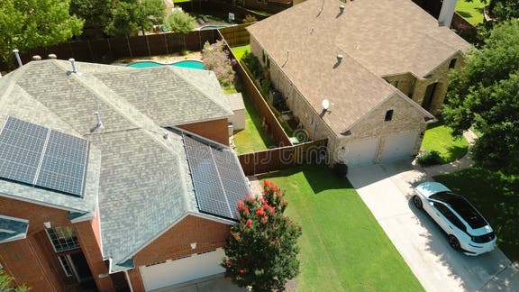 Suburban Homes with Rooftop Solar Panel Arrays, Angled Installations ...
