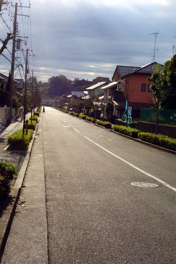 Suburban Straight Road with Sparse Figures Stock Photo - Image of ...