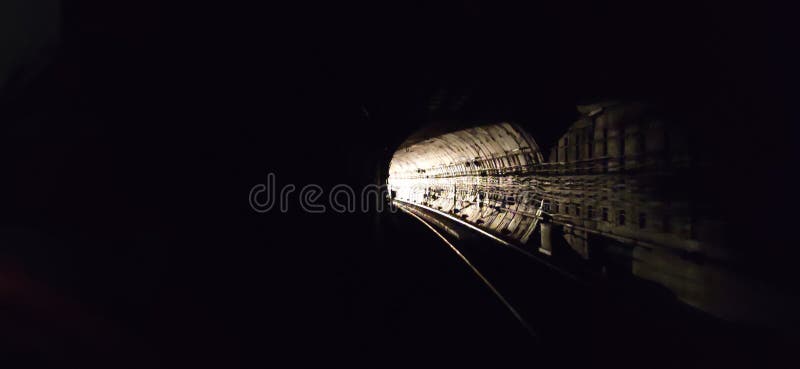 Subway Train in a Dark Tunnel Stock Photo - Image of glass, reflection ...