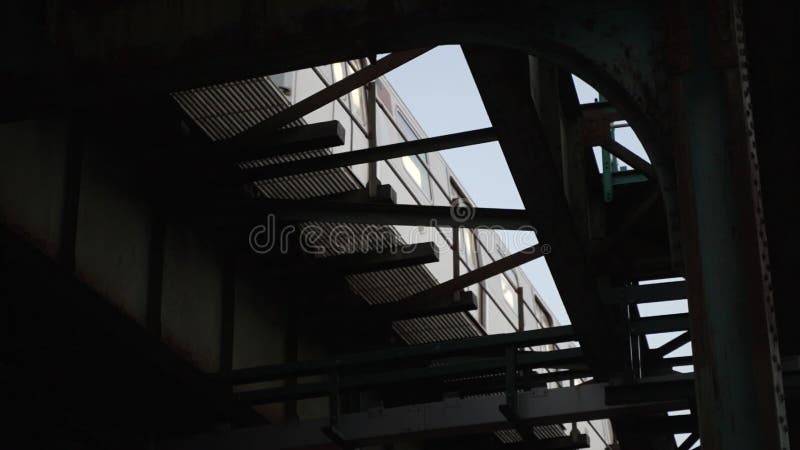 Subway Train Passing Overhead through Industrial Steel Framework ...