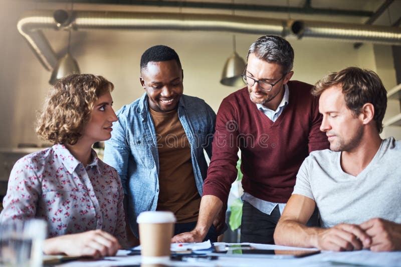 We Succeed through Teamwork. a Creative Team Having a Brainstorming ...