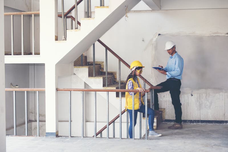 Success Engineer Wear White Helmet for Safety and Checking Building ...