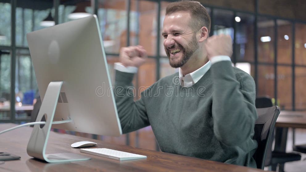 Success Man Celebrating while Working on Computer Stock Photo - Image ...