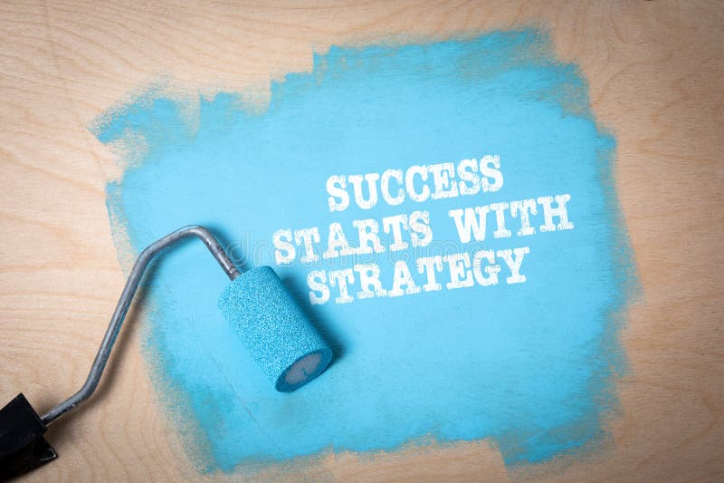 SUCCESS STARTS with STRATEGY. Blue Paint and Paint Roller on Plywood ...