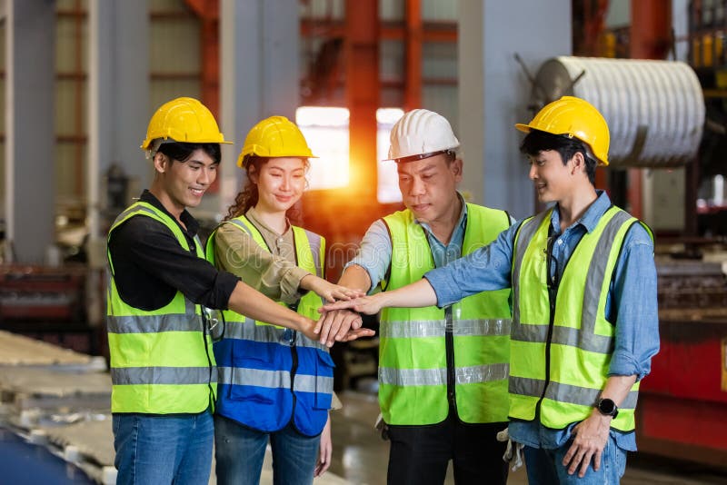 Success Teamwork Concept. Engineer Factory Group Joining Hands ...
