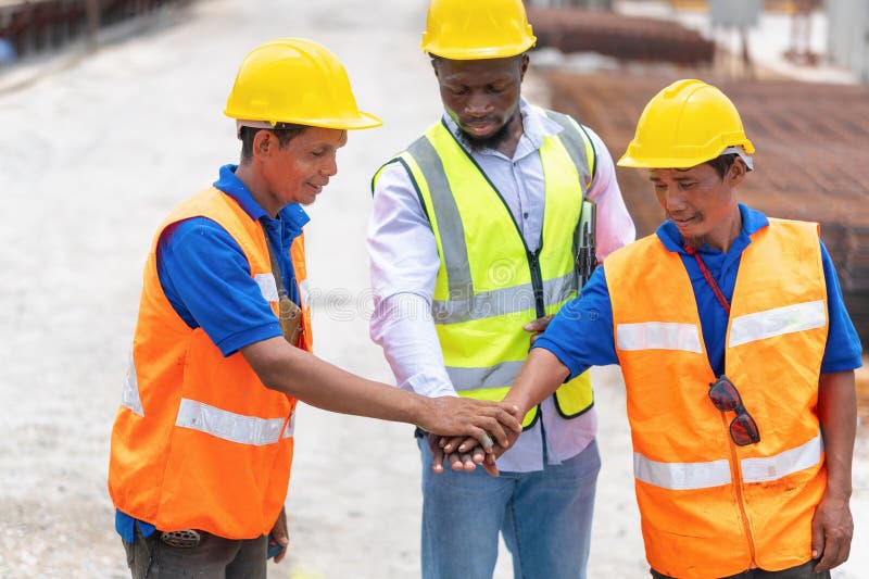 Success Teamwork Concepts, Engineer and Workers Team Joining Hands at a ...