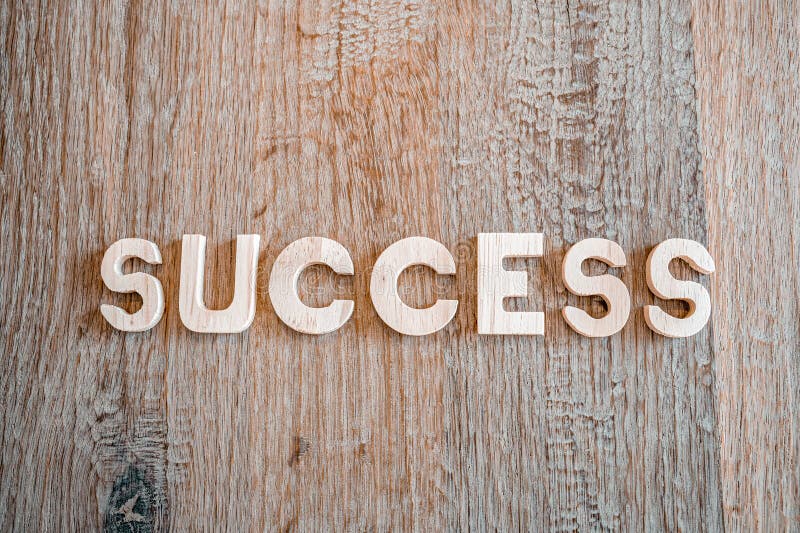 Success in Wooden Letters on a Textured Wooden Background Stock Image ...