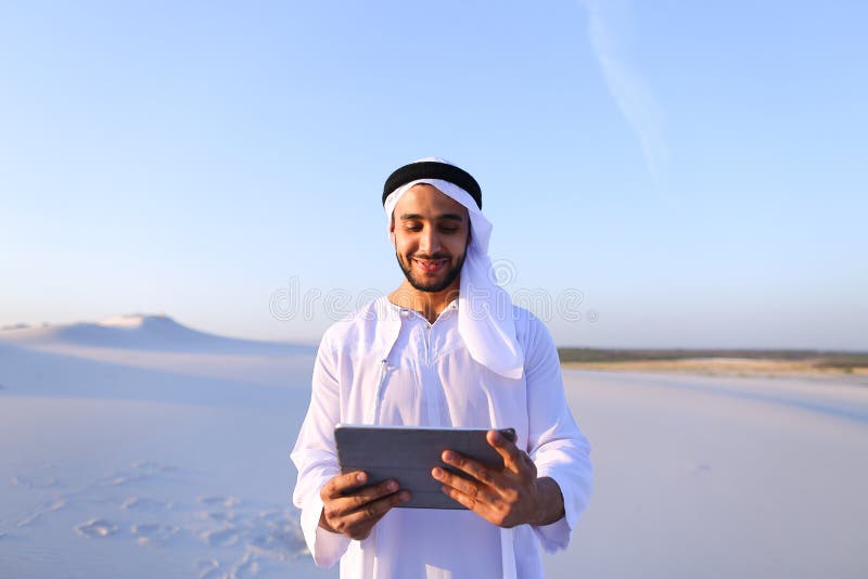 Successful Arabian Businessman Holds in Hands and Uses Tablet, S Stock ...