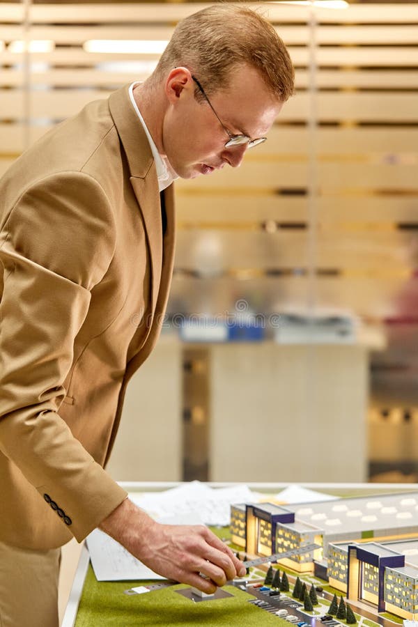 Successful Architect Plans, Calculates Distance, Scale of the Building ...