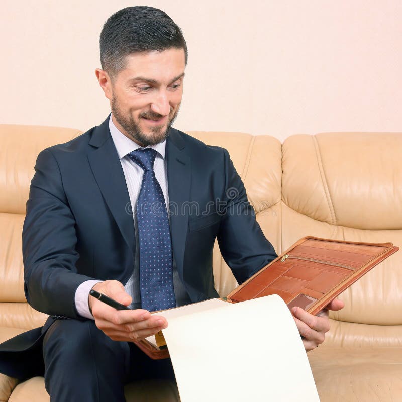 Successful Business Man Engaged in Business Documents Sitting on a ...