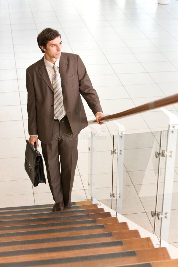 Successful Business Man Moving Up Stock Image - Image of suit, handsome ...