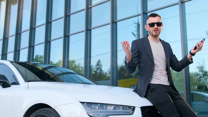 Successful Business Man Talking about Finances Looking at the Camera ...