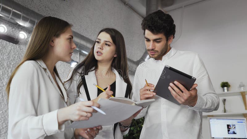 Successful Business People Discussing the Project in the Office. Stock ...