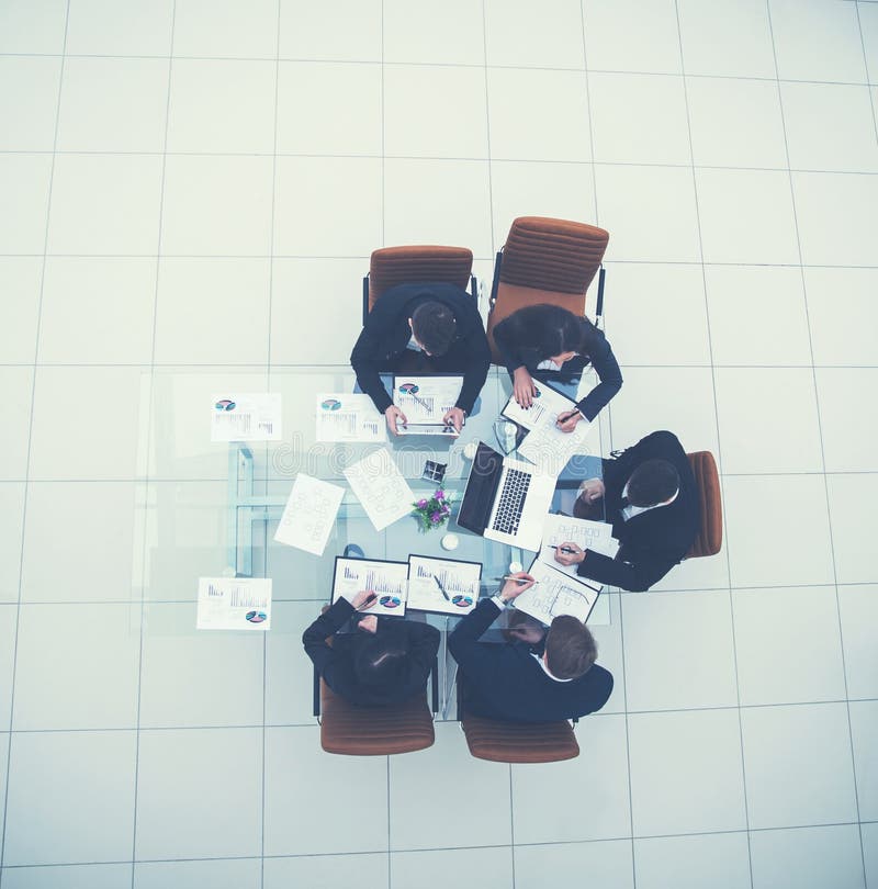 Successful Business Team Discussing a New Marketing Schemes in the ... Successful Business Team Discussing a New Marketing Schemes in the ...