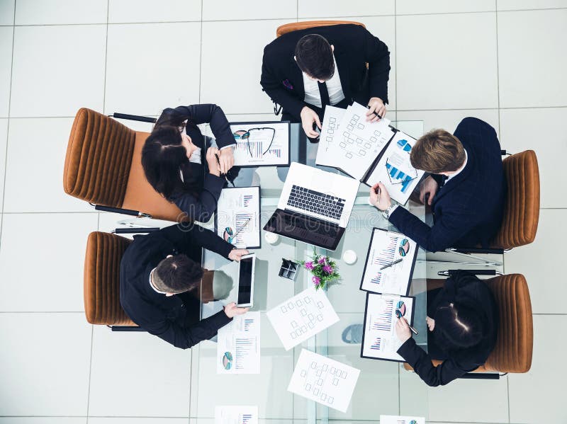 Successful Business Team Discussing a New Marketing Schemes in the ... Successful Business Team Discussing a New Marketing Schemes in the ...