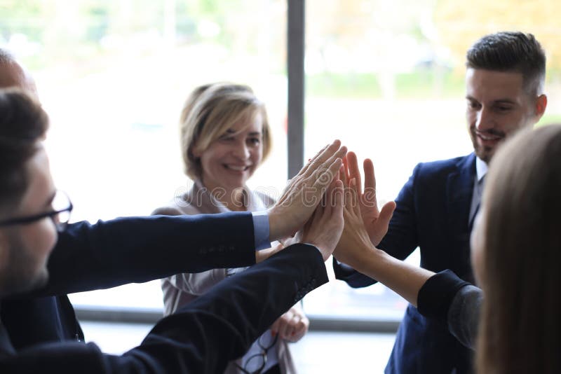 Successful Business Team Giving Each Other High Five Standing in the ...