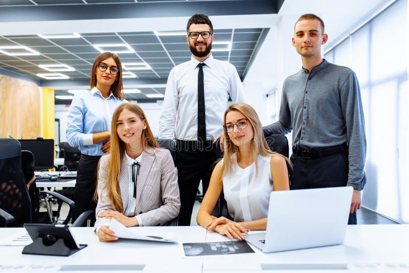 Successful Business Team Standing Together and Smiling Working in the ...