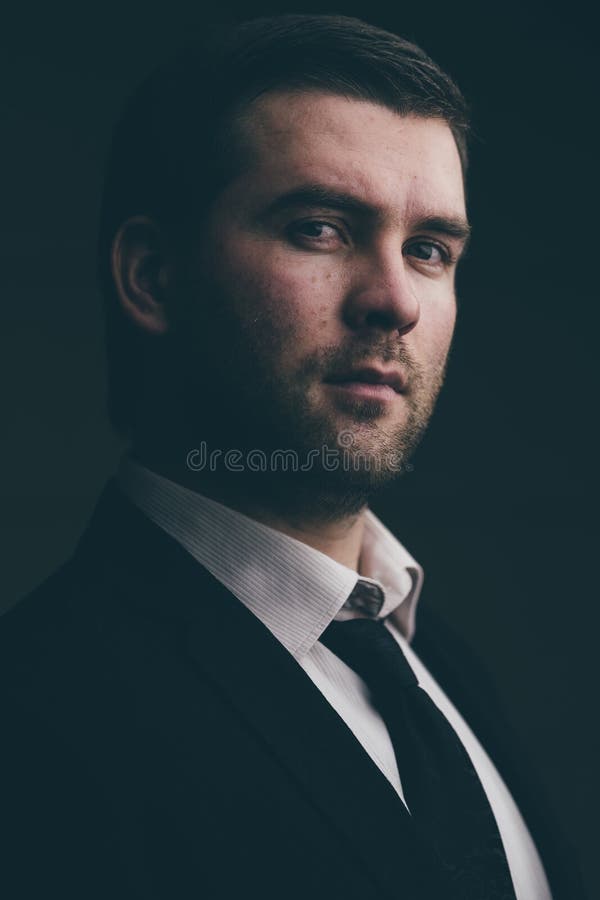 Successful Businessman on a Dark Background Stock Photo - Image of ... Successful Businessman on a Dark Background Stock Photo - Image of ...