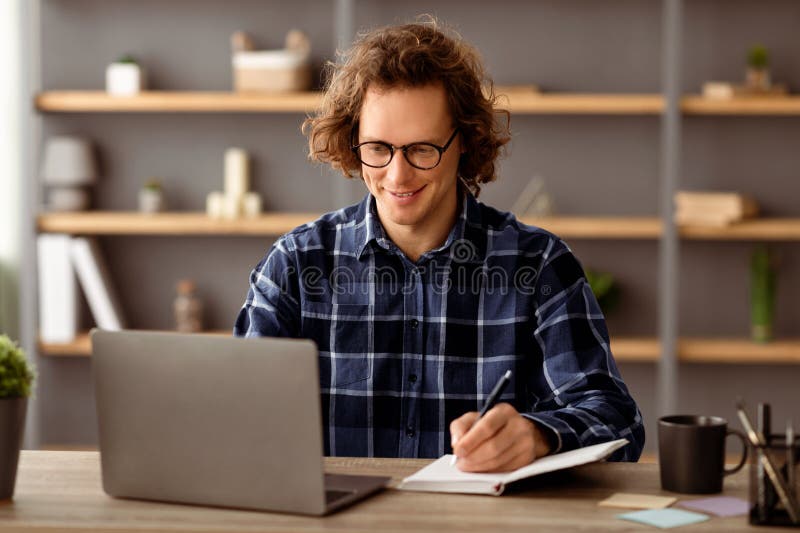 Successful Businessman at Laptop Writing Taking Notes Sitting at ...
