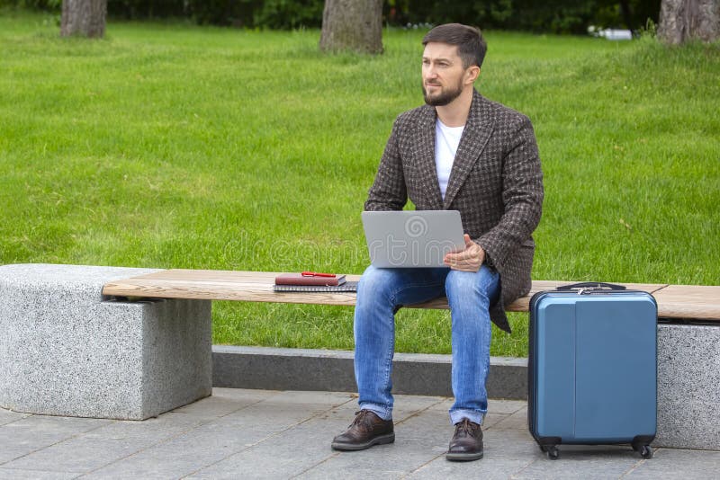 Successful Businessman Resting on a City Bench after a Completed Work ...