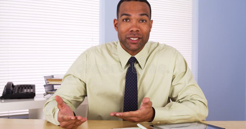 Successful Businessman Talking To Camera Stock Photo - Image of meeting ...