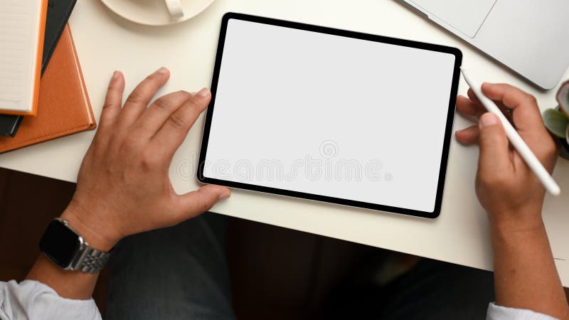 Businessman Using Portable Tablet Computer at His Workspace Stock Photo ...